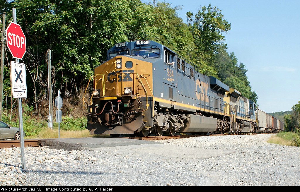 205 - CSXT 934 on the U16102 passes the crossing leading into the power plant